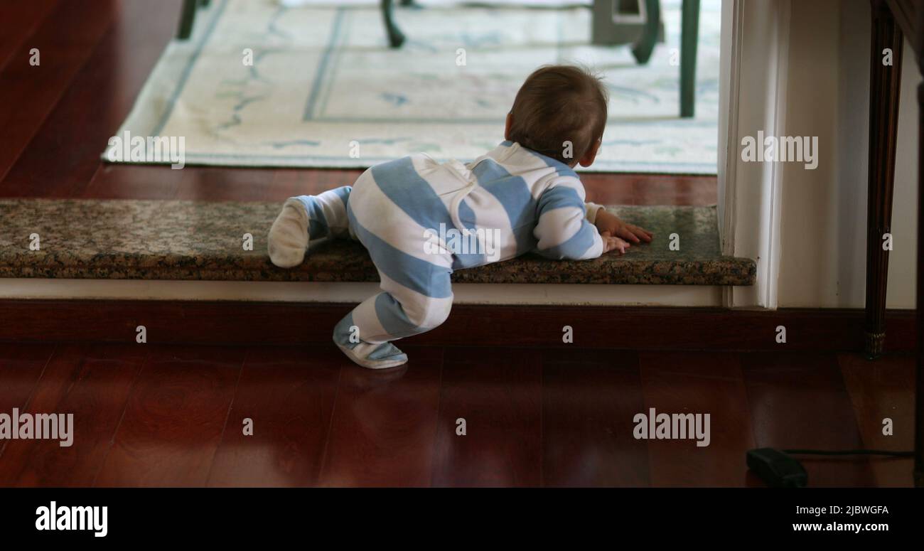 Baby toddler descending home step. infant learning development Stock ...