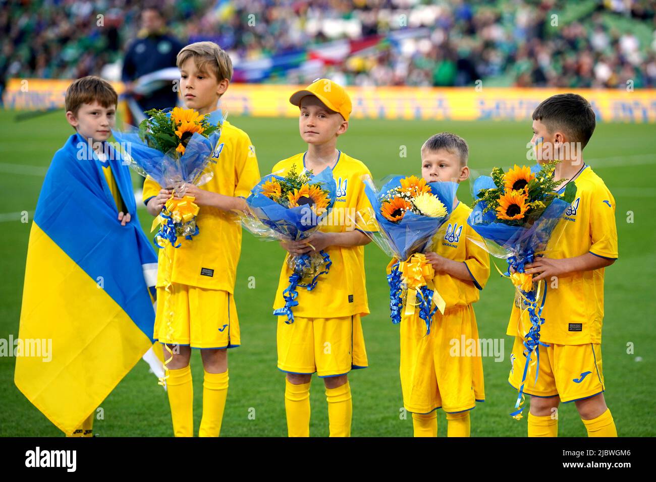 Ukraine mascot's walk out draped in the nation's flag and carrying ...