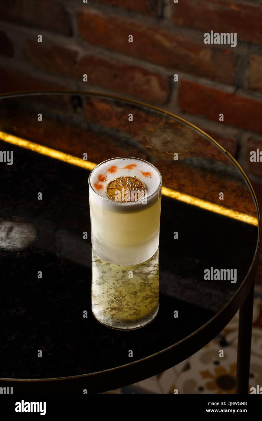 Pisco sour cocktail - whiskey with lime, egg white, sugar syrup in ...