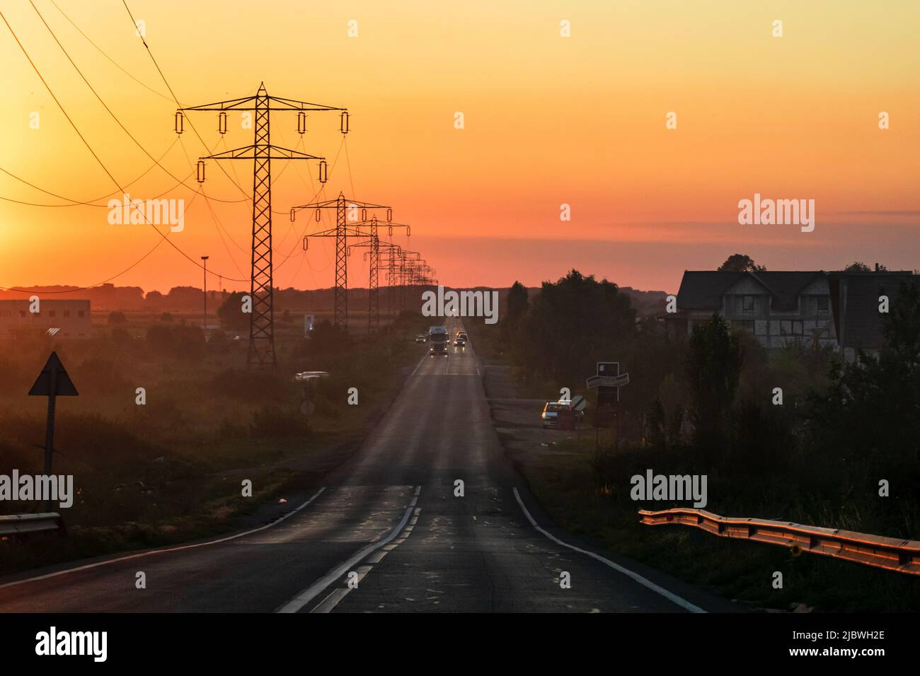 Electric power pylon, electric tower at sunset Stock Photo - Alamy