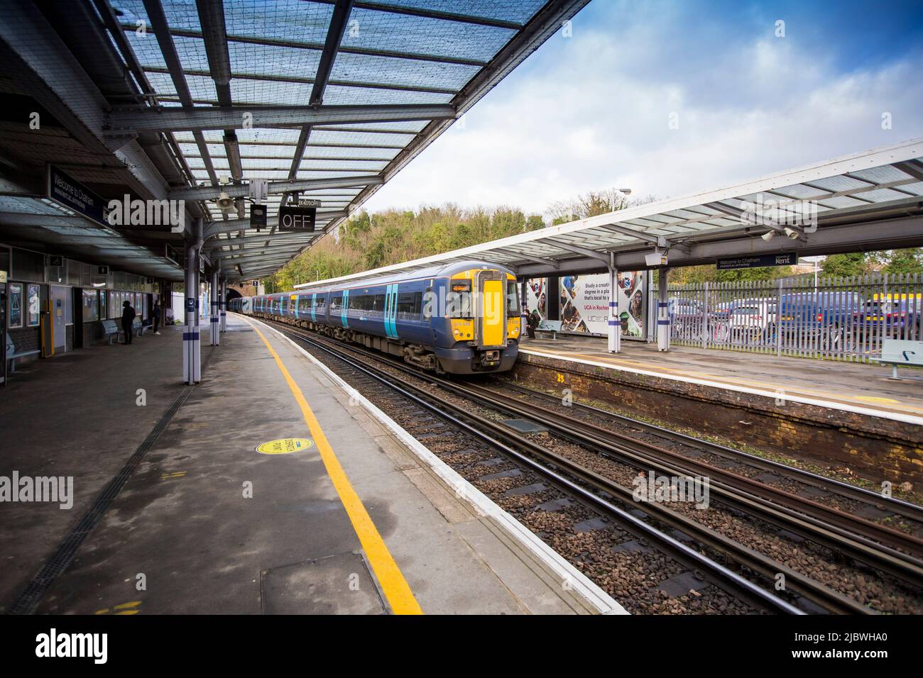 Passengers and trains at the platforms at Chatham railway station ...