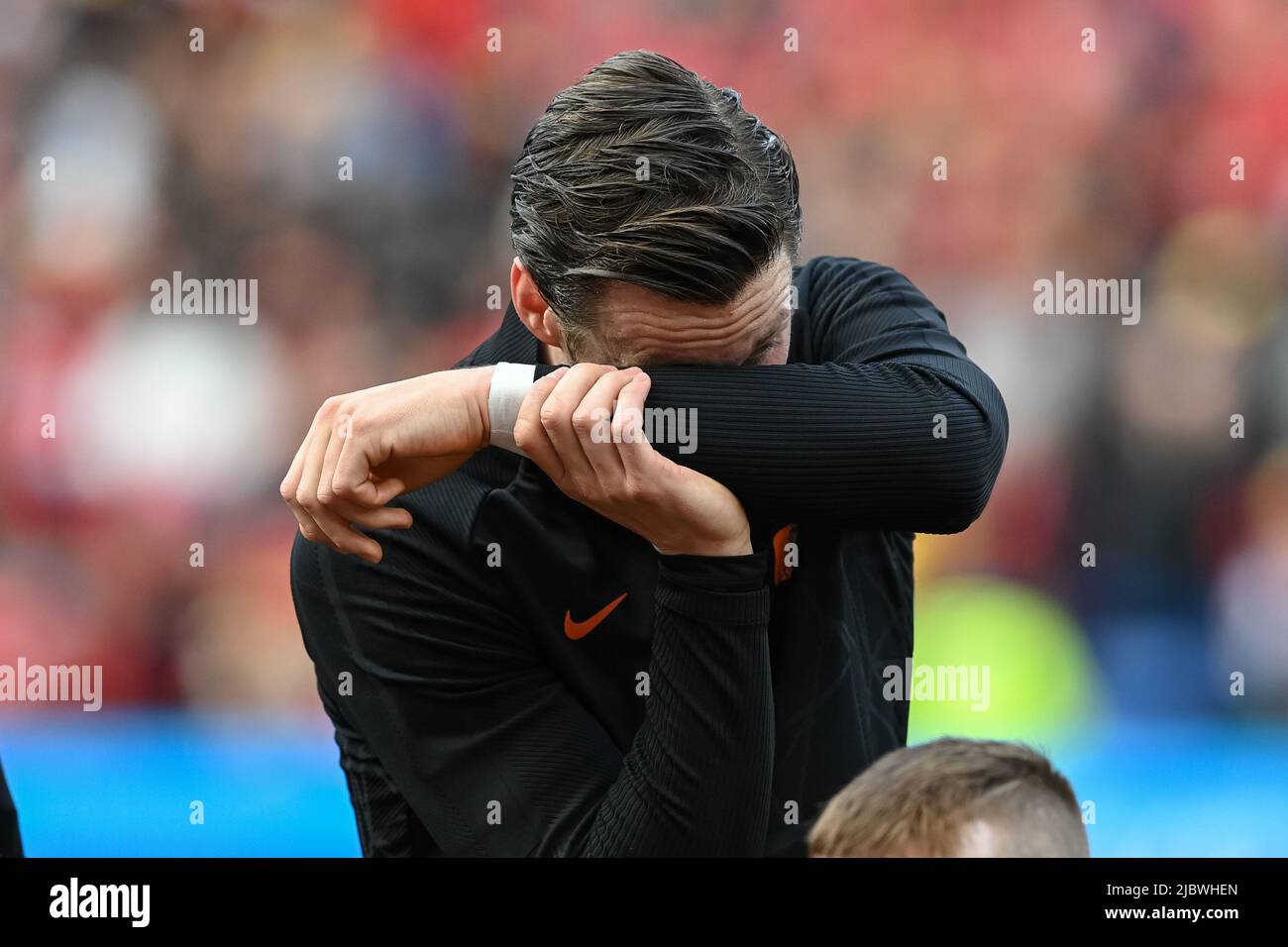 Wout Weghorst of the Netherlands wipes tears off his face after singing ...