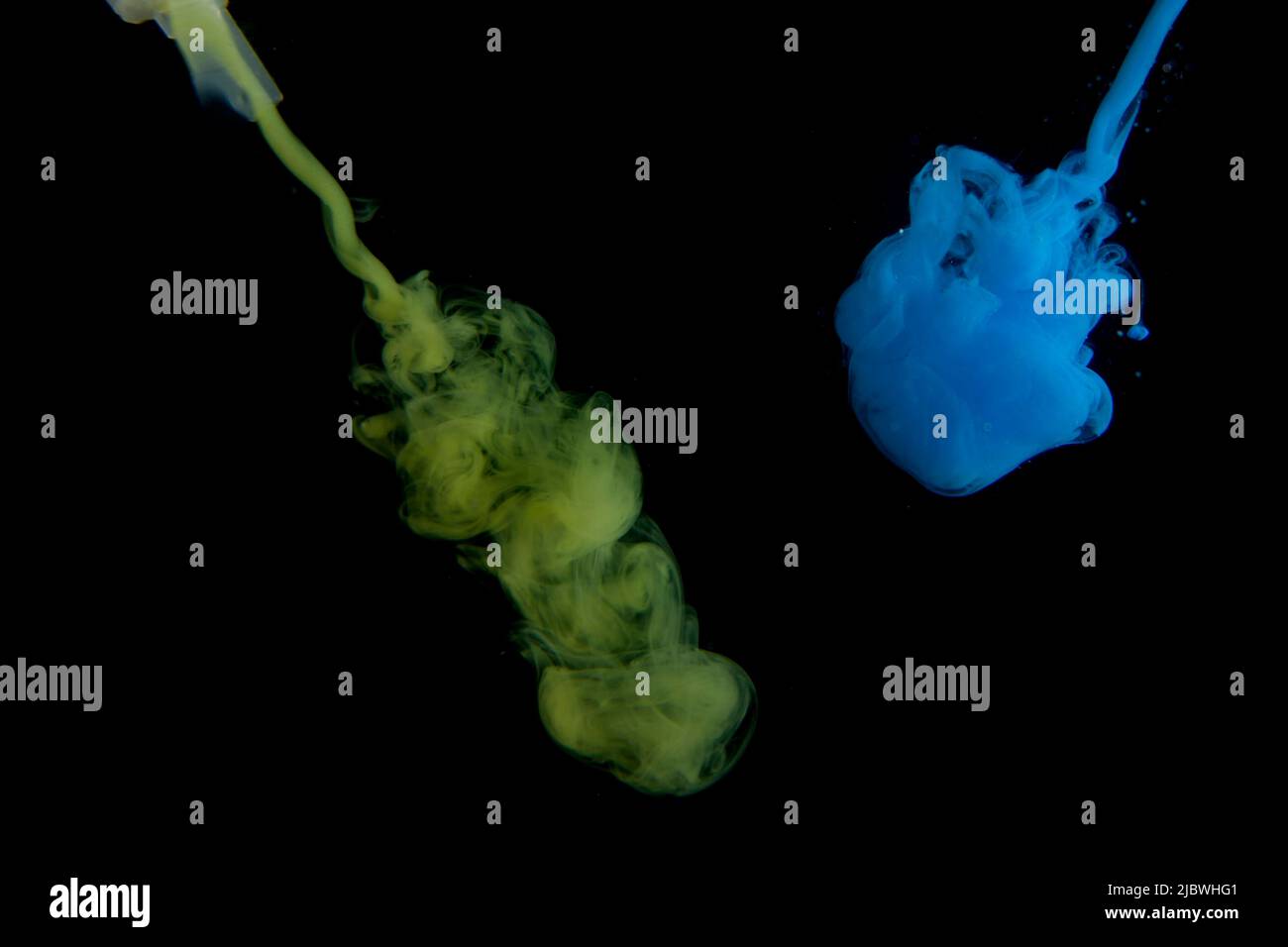 Color drop in water isolated on white background Stock Photo - Alamy