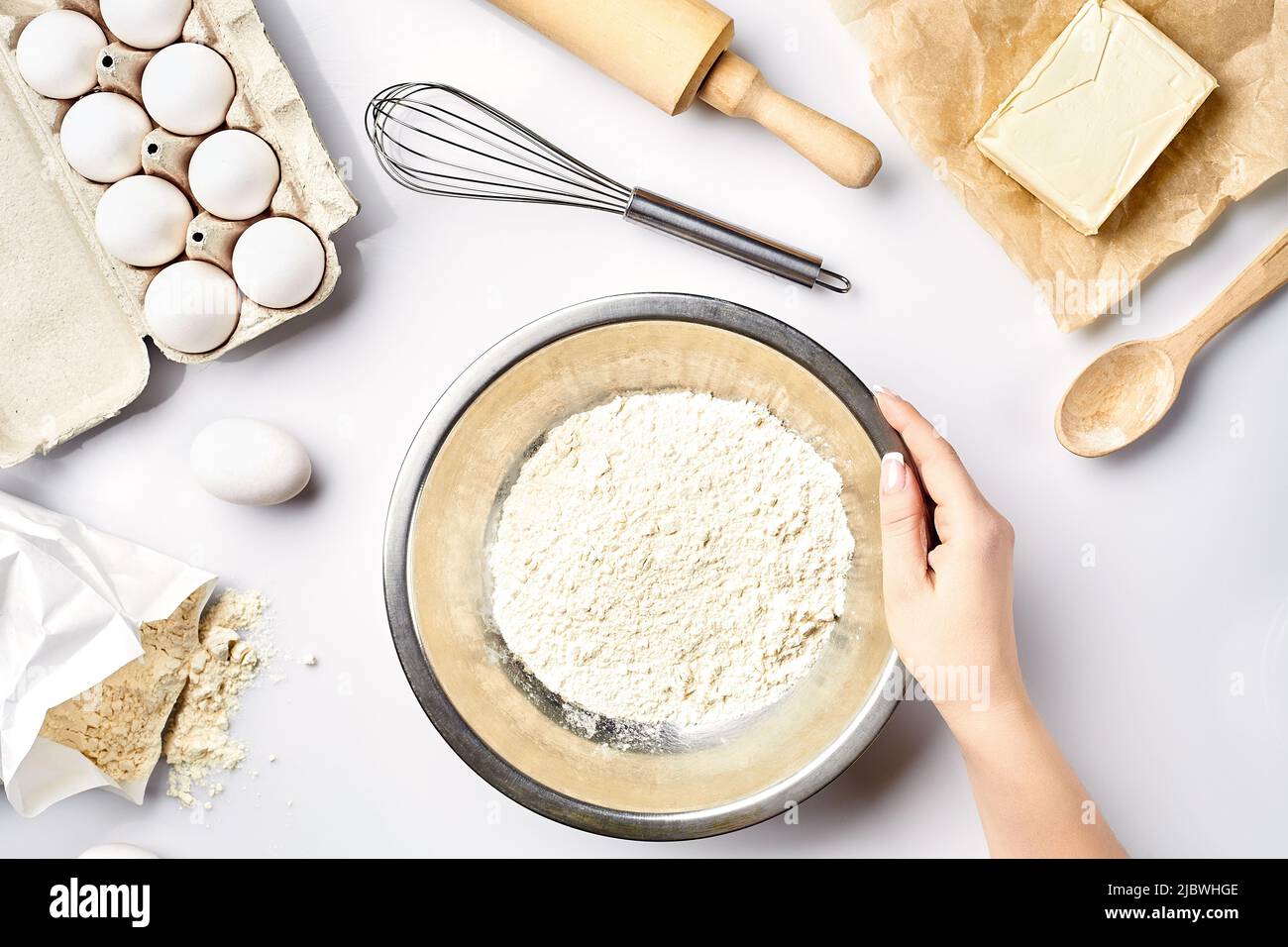 Hand sift flour. Bakery prepare for make cake. Top view Stock Photo - Alamy