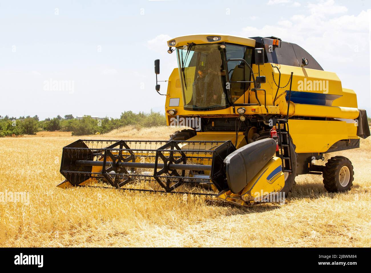 Combine harvester harvesting barley fields Stock Photo - Alamy