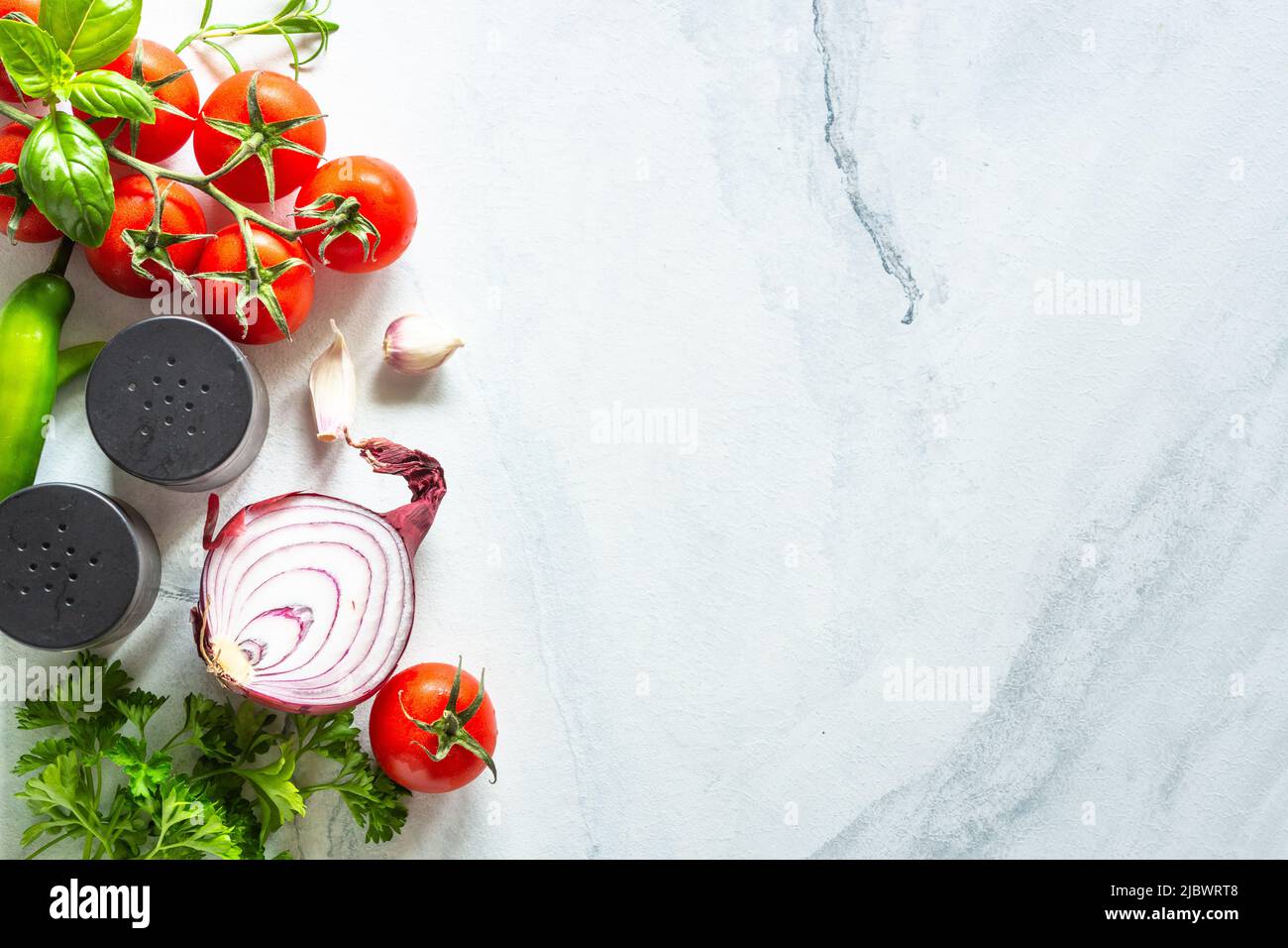 Food cooking background on white marble table Stock Photo - Alamy