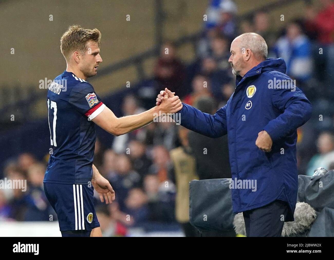 Scotland's Stuart Armstrong greets manager Steve Clarke as he leaves ...