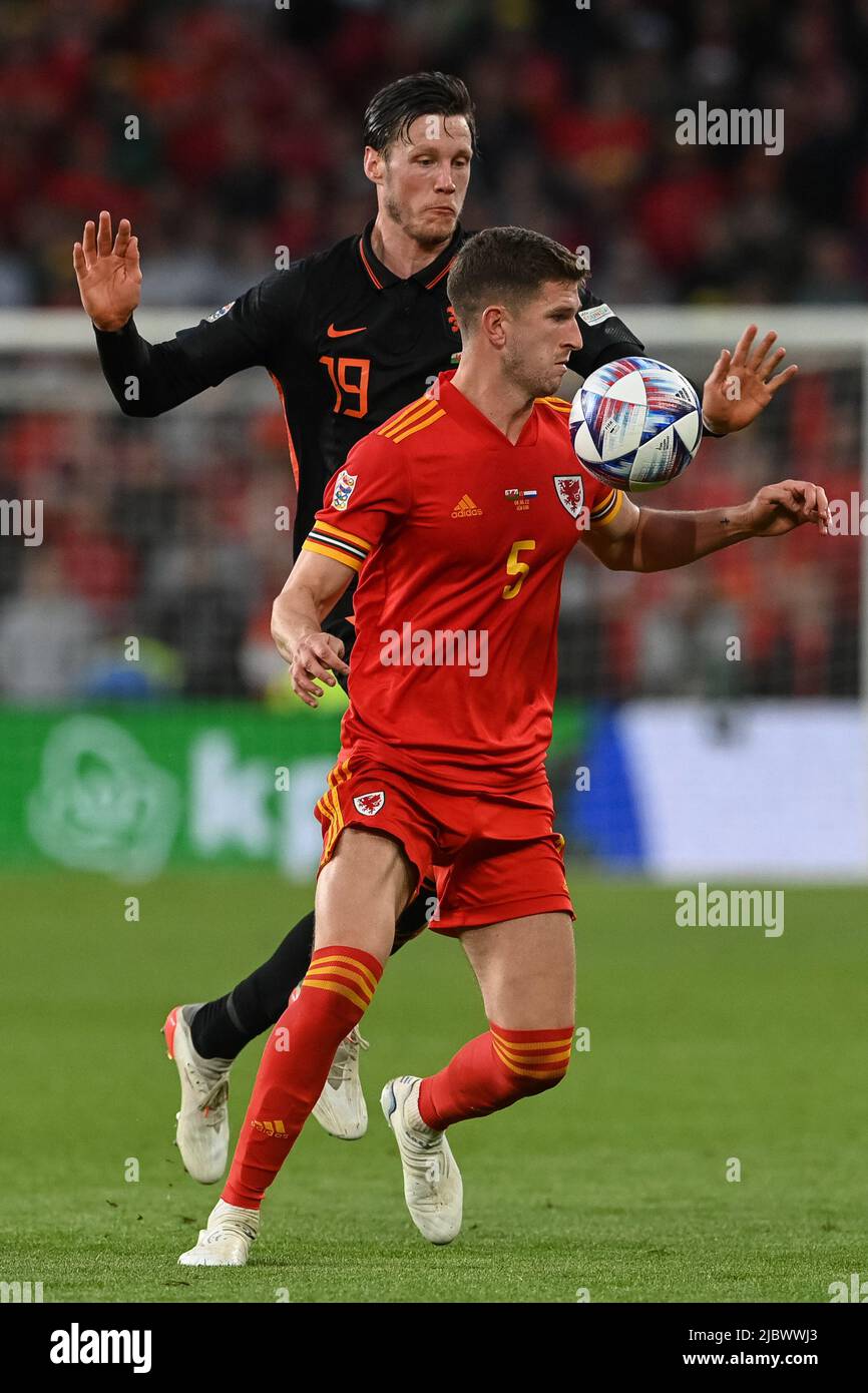 Chris Mepham of Wales and Wout Weghorst of the Netherlands battle for ...
