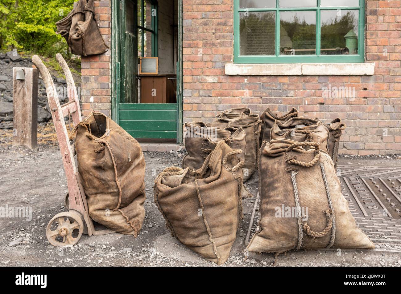 sack bags filled with coal and a vintage sack truck retro fuel delivery ...