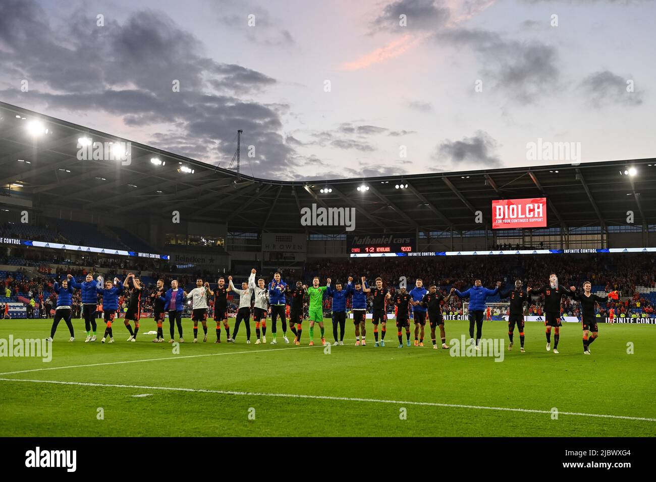 The Netherlands squad celebrate their 1-2 win with the traveling fans ...