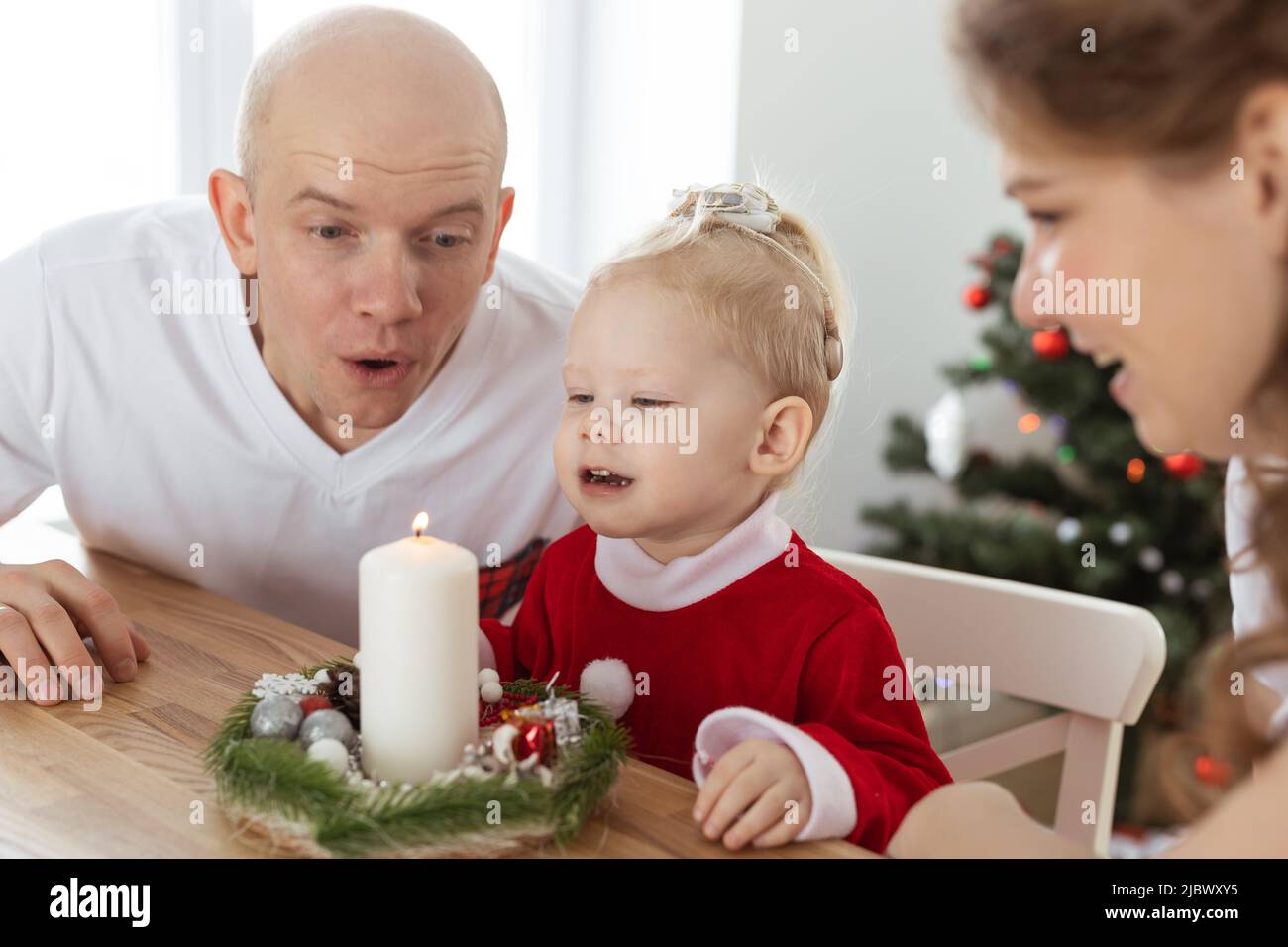 Baby child with hearing aid and cochlear implant having fun with ...