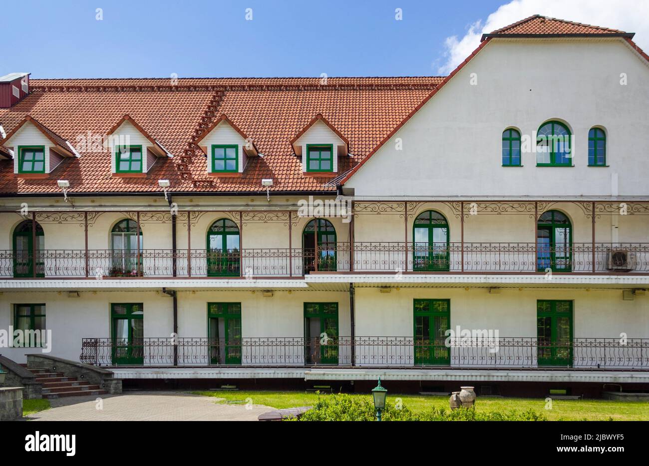 Belarus, Minsk - June 6, 2022. Two-story beautiful long house Stock ...