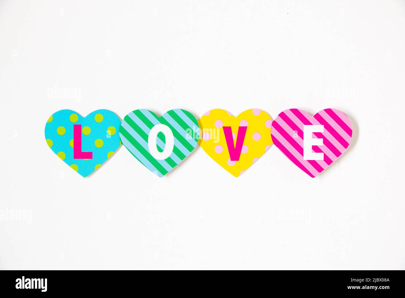 Love in colorful hearts isolated on white background Stock Photo - Alamy