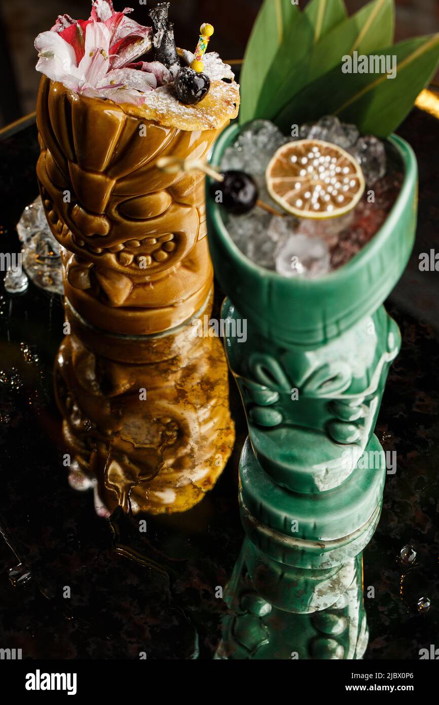 Tiki Drink Cocktails. Two cocktails in different glasses against the ...