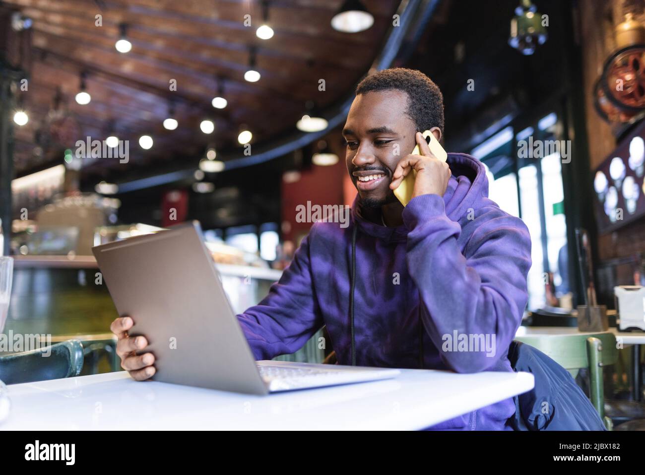 Black man doing remote work hi-res stock photography and images - Alamy