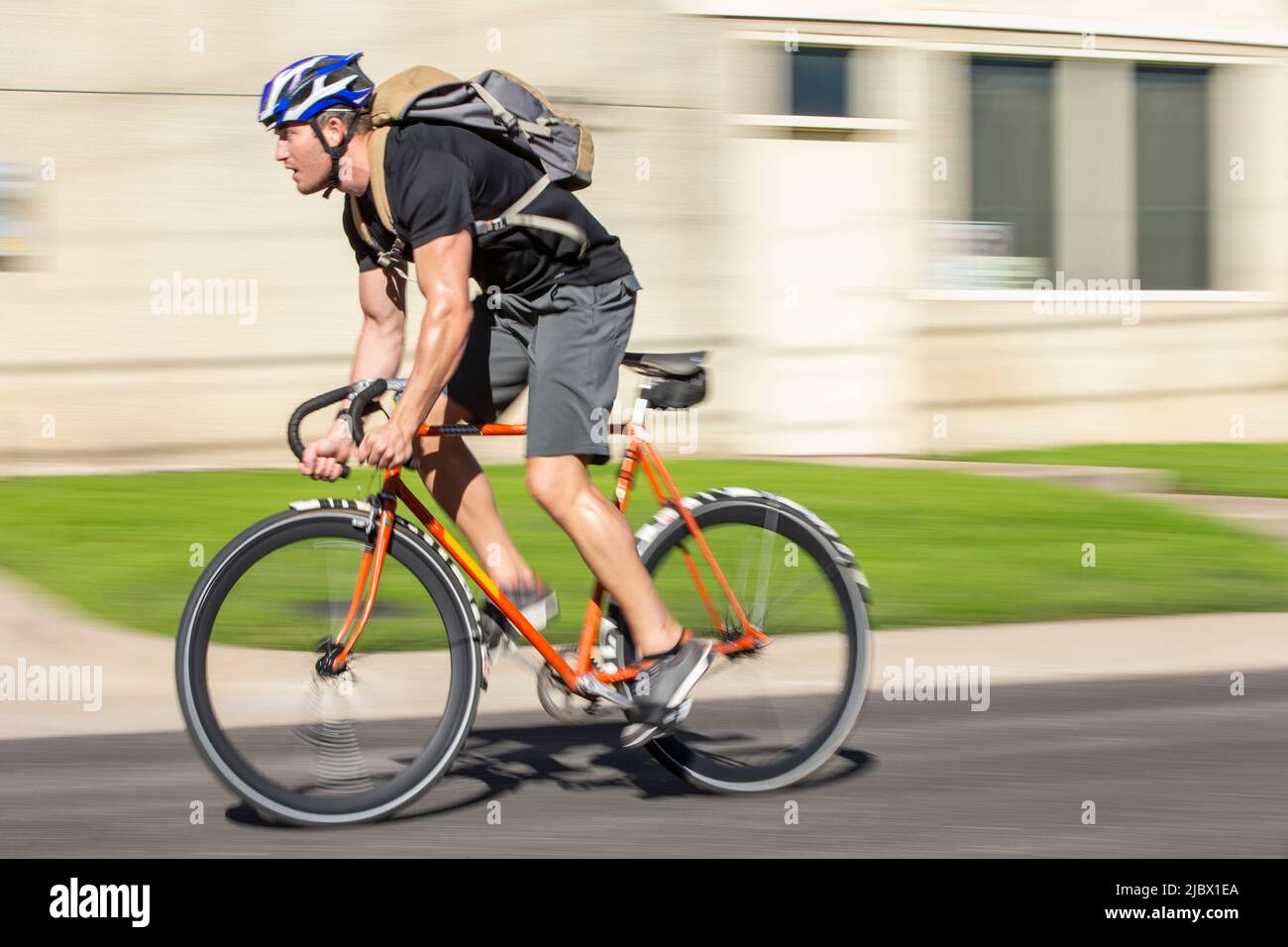 Riding bike through city hi-res stock photography and images - Alamy