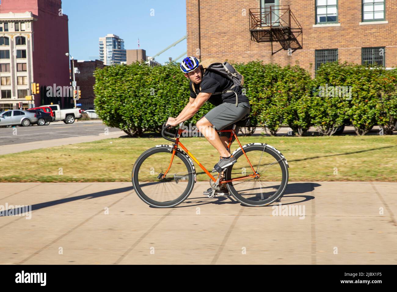 Commuter riding bike on lane hi-res stock photography and images - Alamy