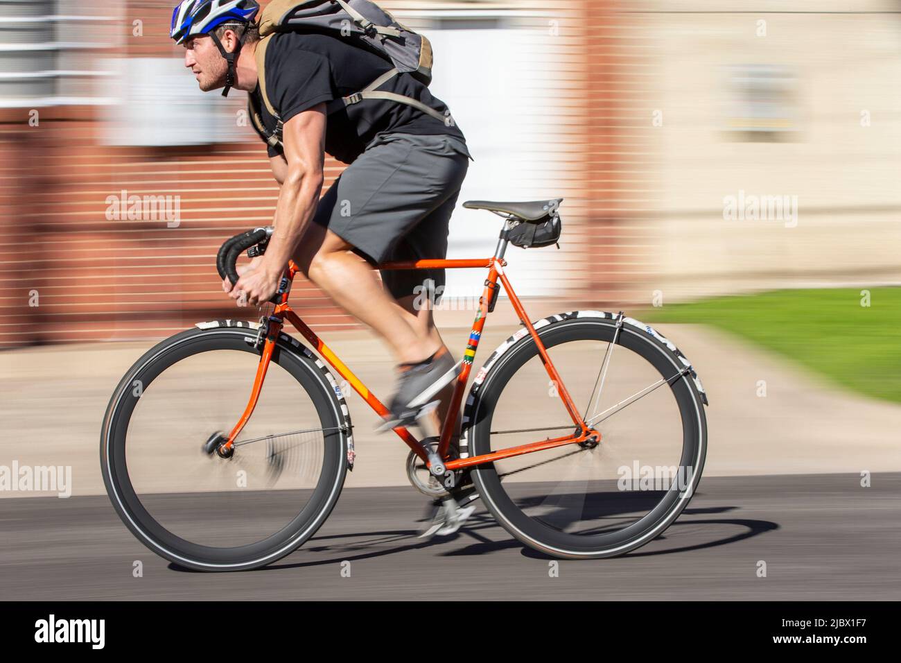 Bike Messenger out on the road for a delivery Stock Photo - Alamy