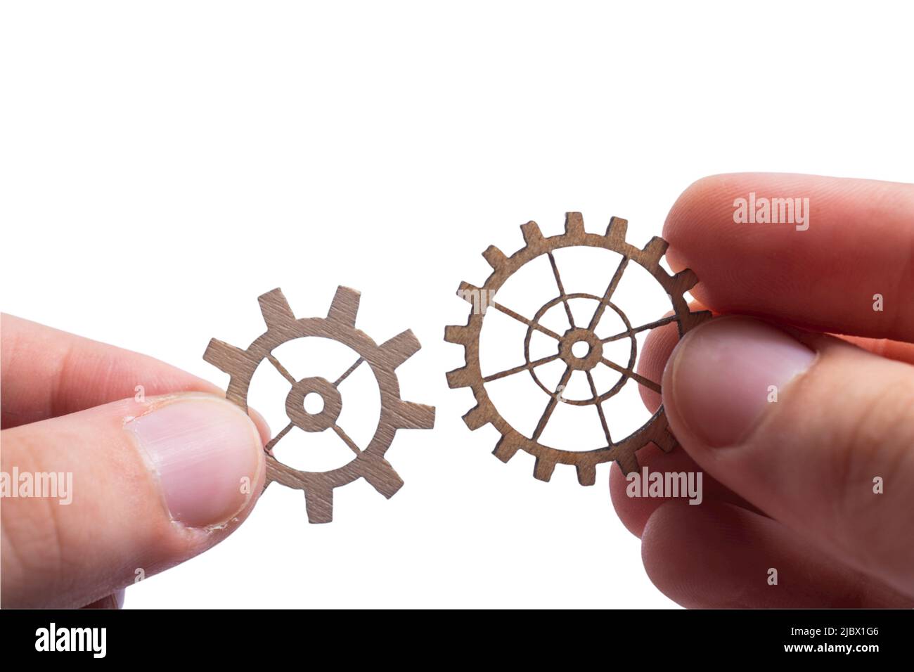 Hand holding gear wheels isolated as the concept of mechanics Stock ...