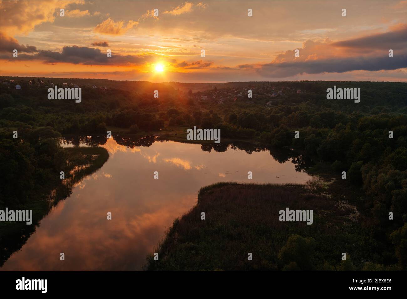 Sunset above the river in natural rural landscape Stock Photo - Alamy