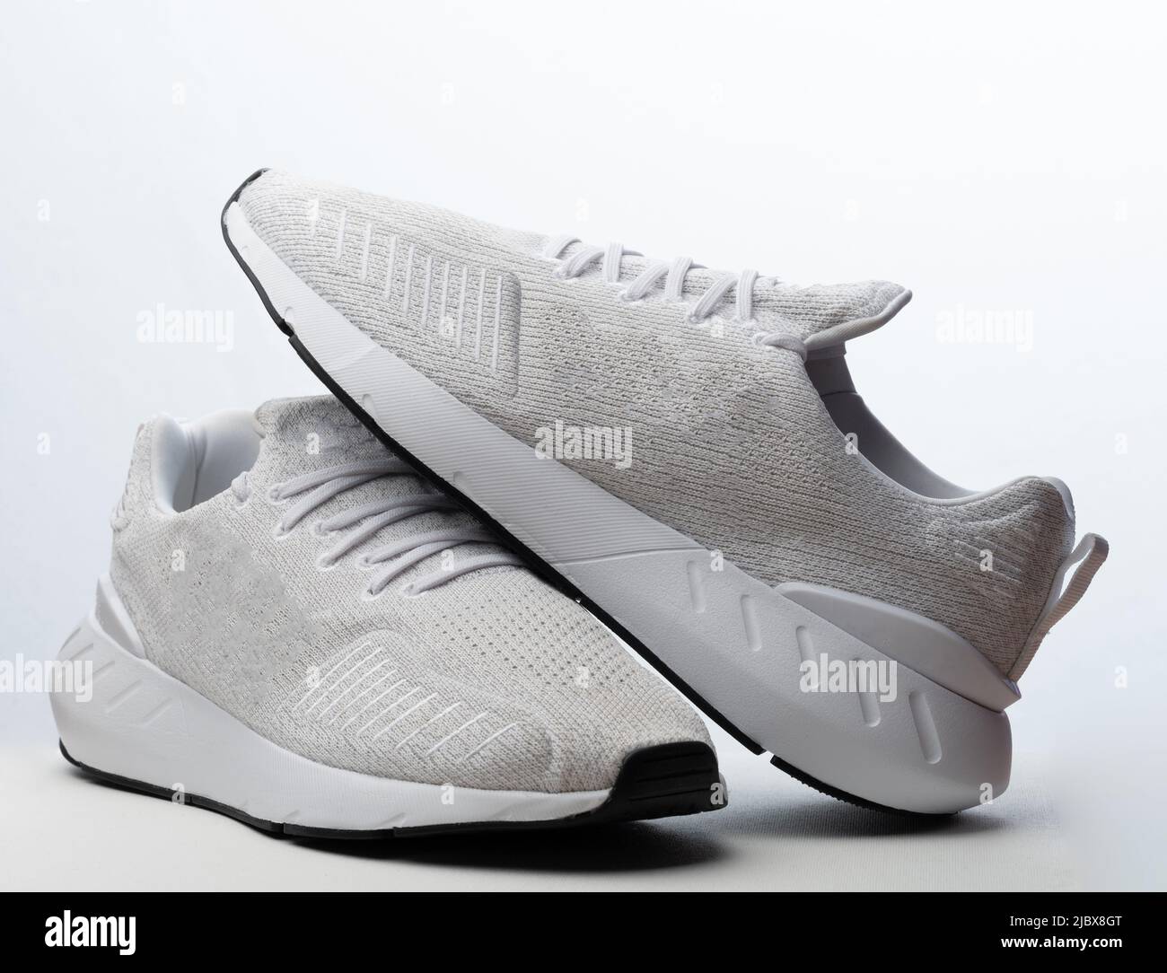 Pair of grey cloth sneakers isolated on white studio background Stock ...