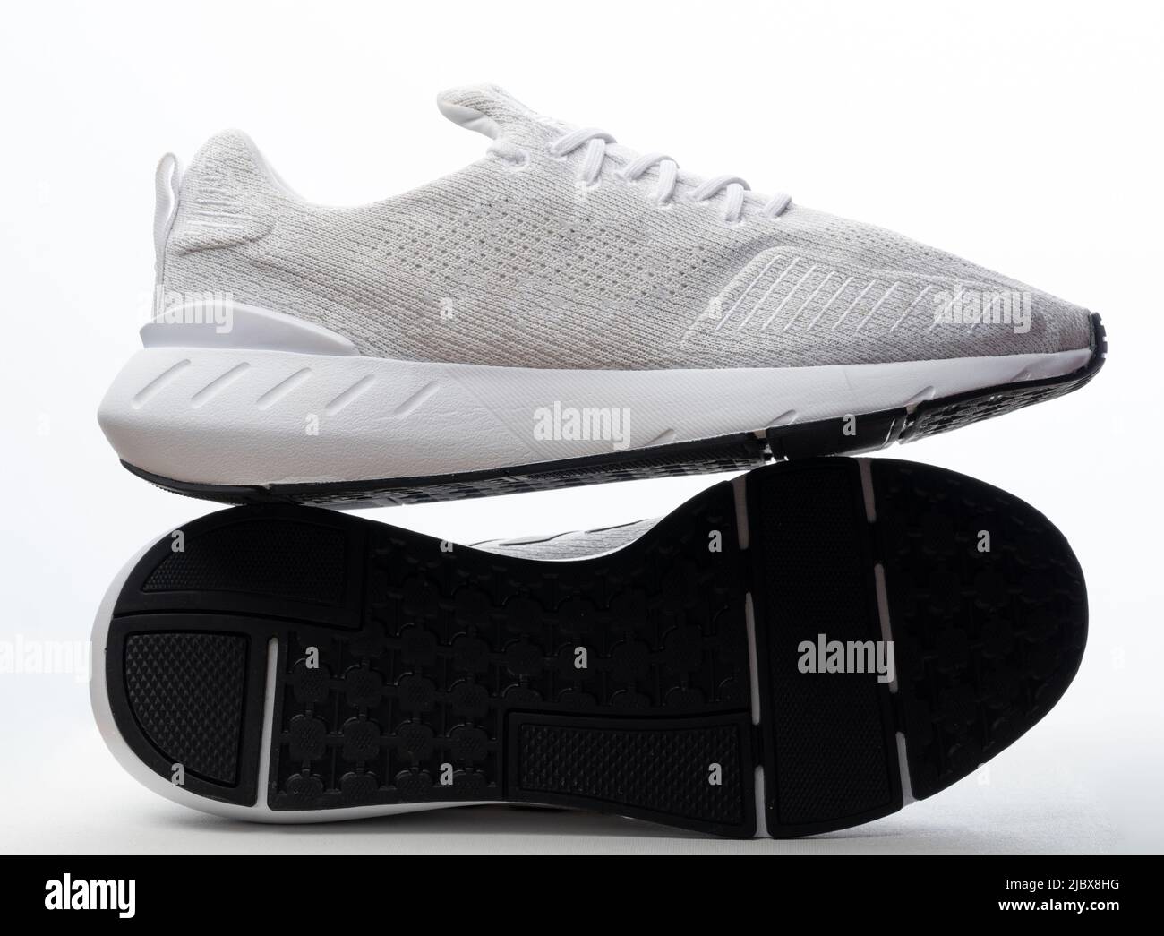 Sole and back view of sport shoes isolated on studio background Stock ...