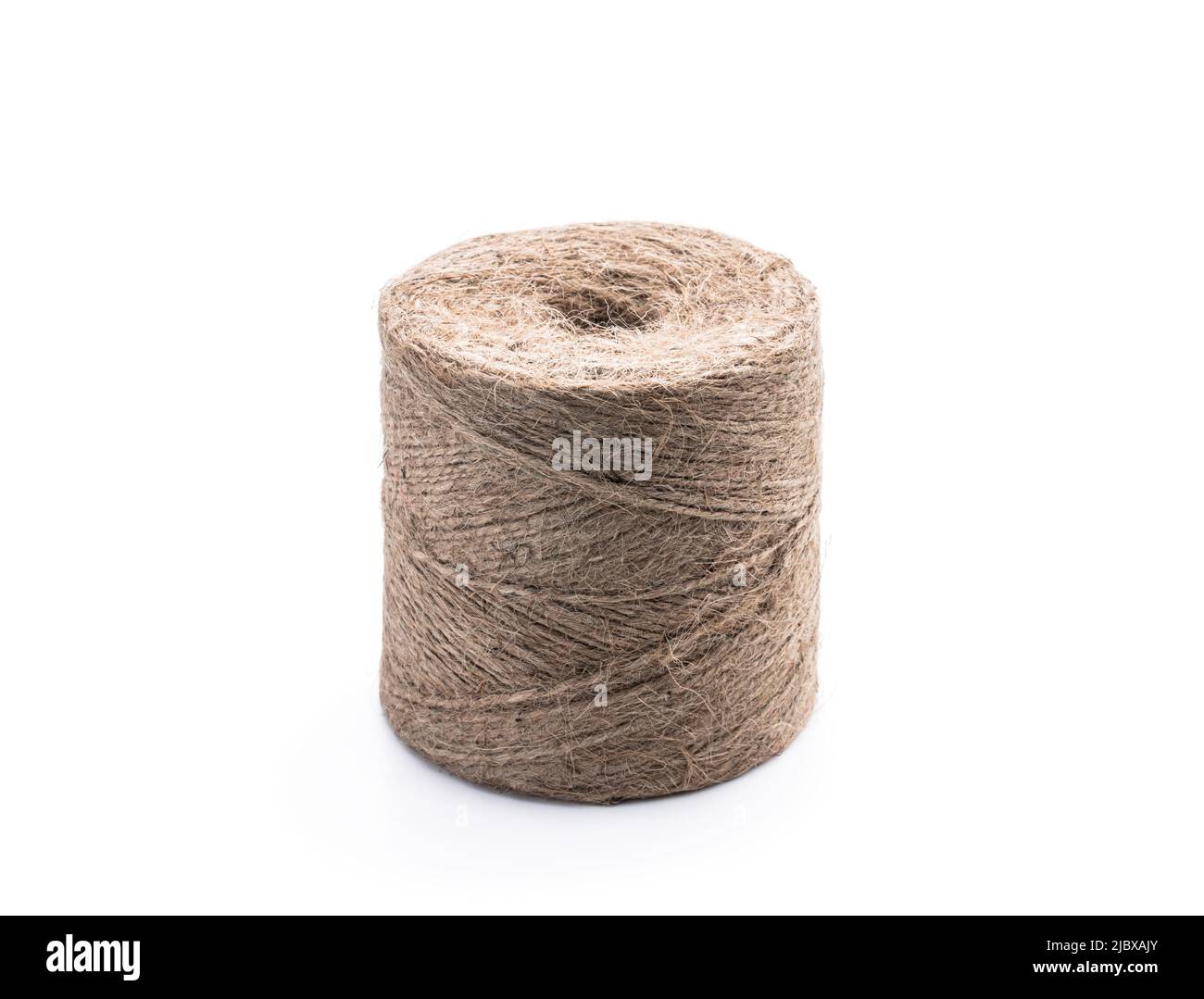 Rolled jute twine isolated on white Stock Photo - Alamy