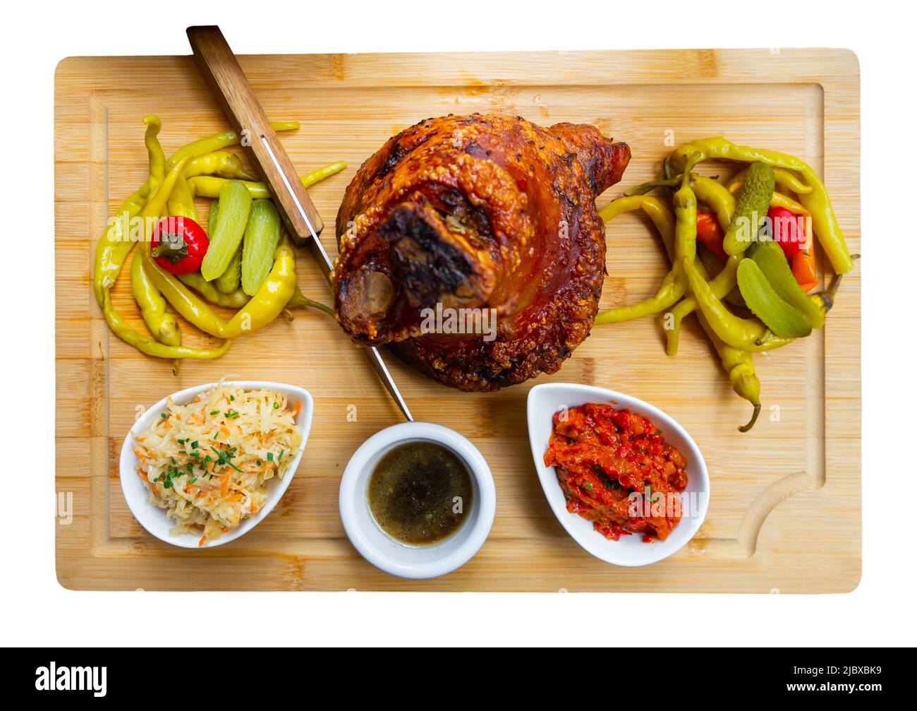 Roasted Ham Hock with pickled vegetables on wooden tray Stock Photo - Alamy