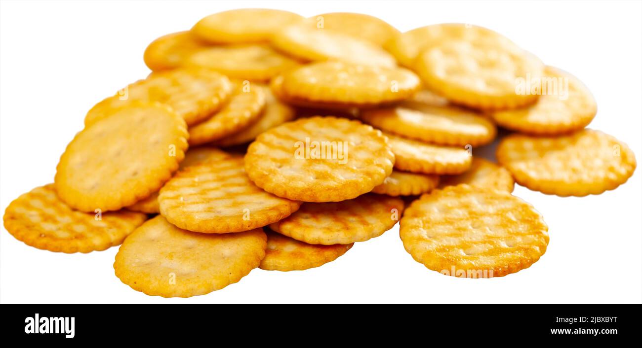 Crispy salted round crackers on white table Stock Photo - Alamy