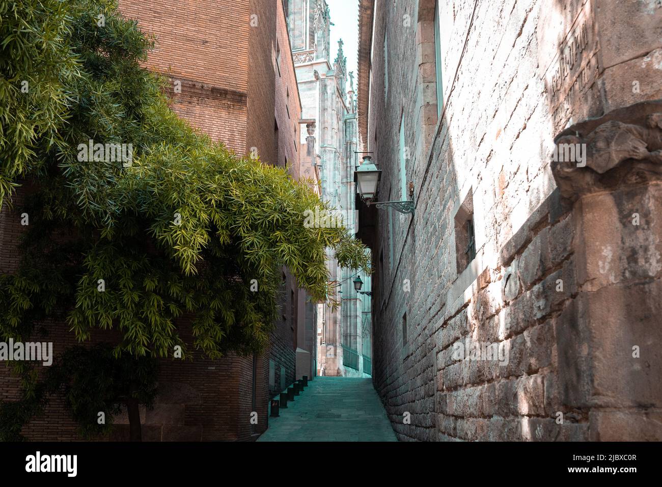 Narrow passageway between old stone brick building walls. View of an ...