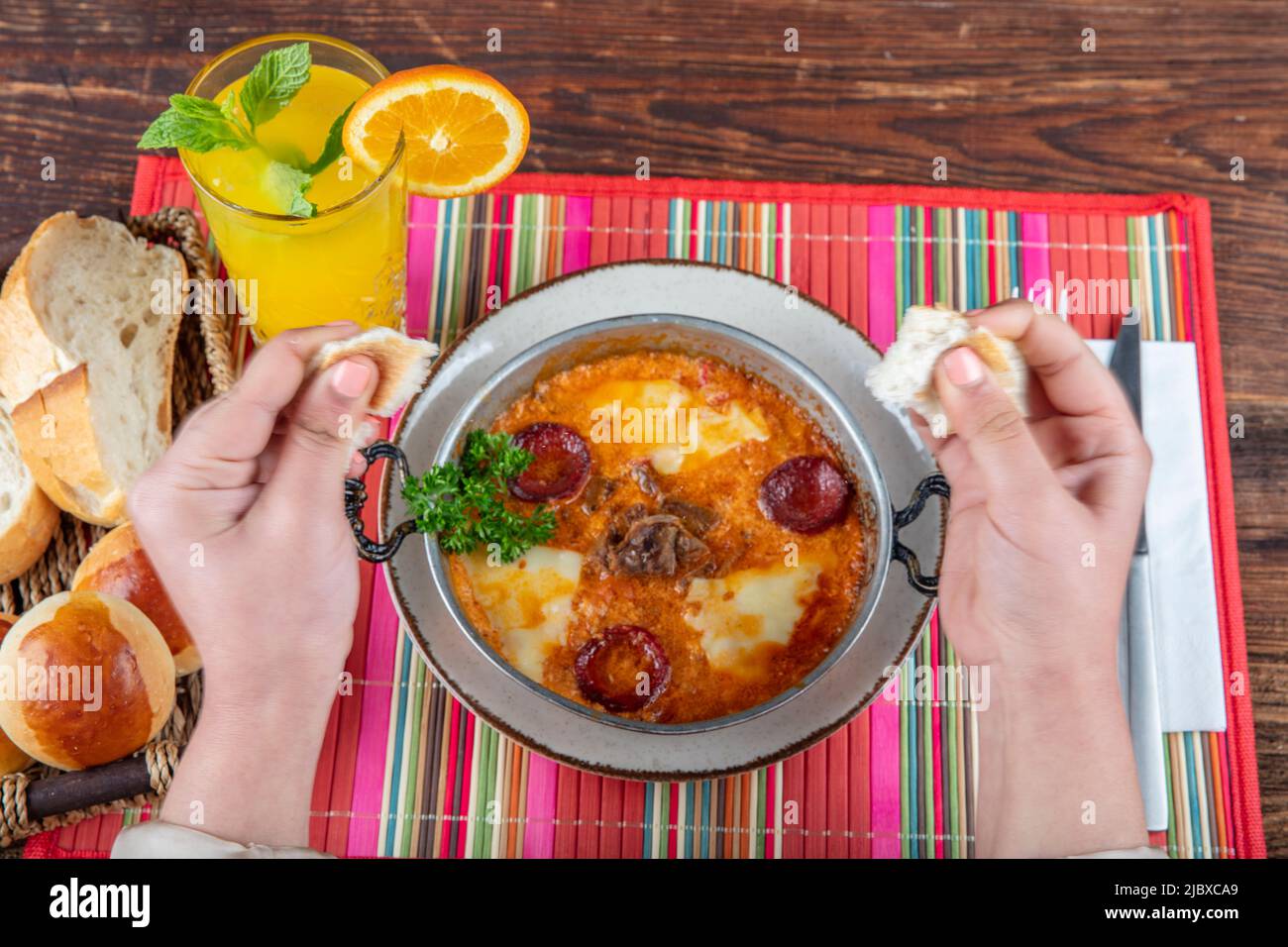 Traditional turkish food menemen, made by eggs, sausage (sucuk) and ...