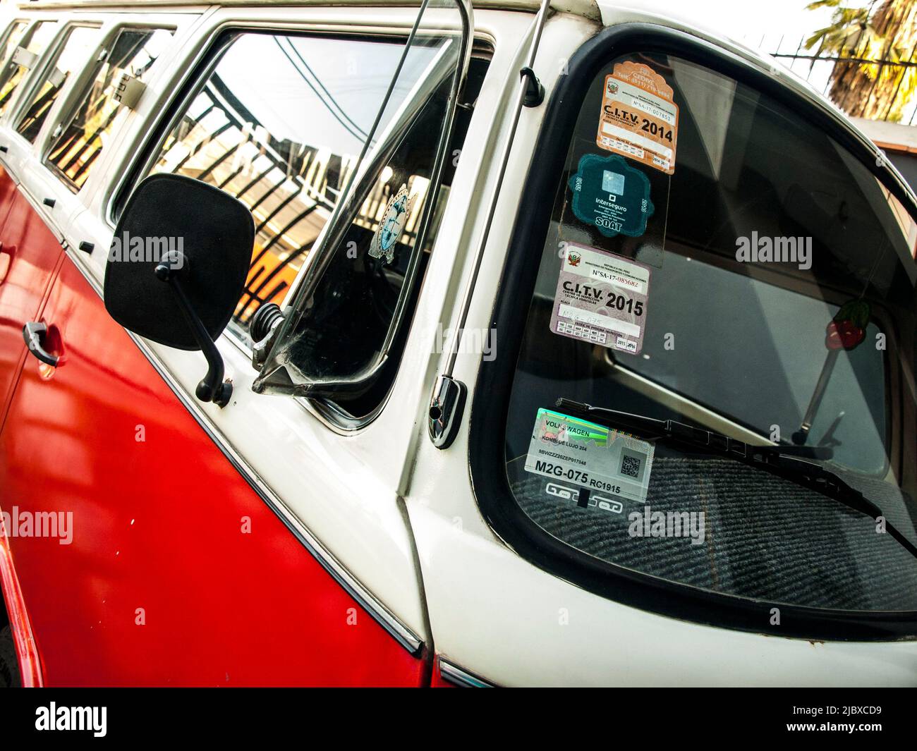 Side view of a red and white Volkswagen T2 14 windows Brazilian Kombi ...