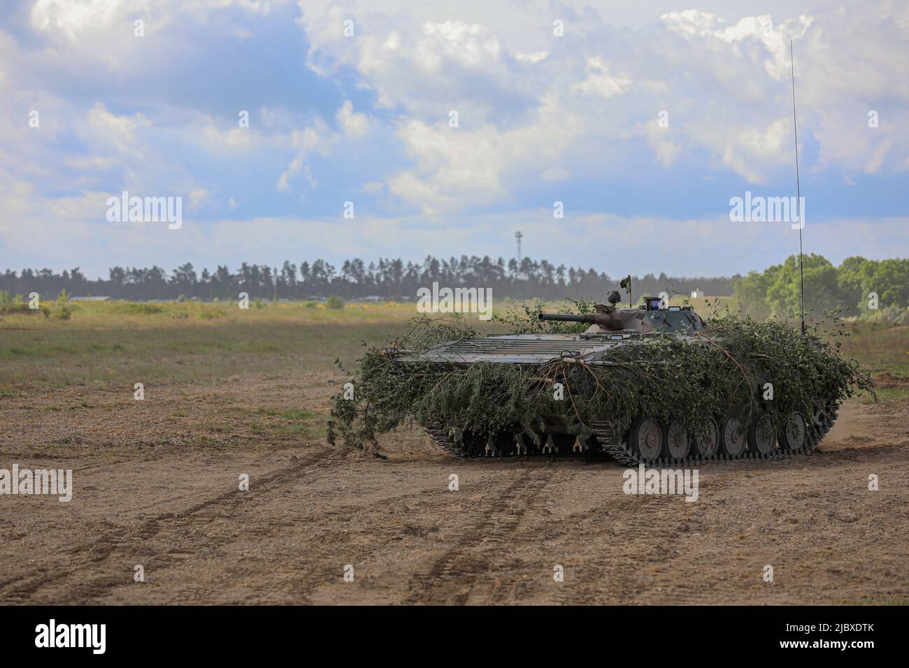 A Polish army BMP-1 infantry fighting vehicle advances onto the field ...