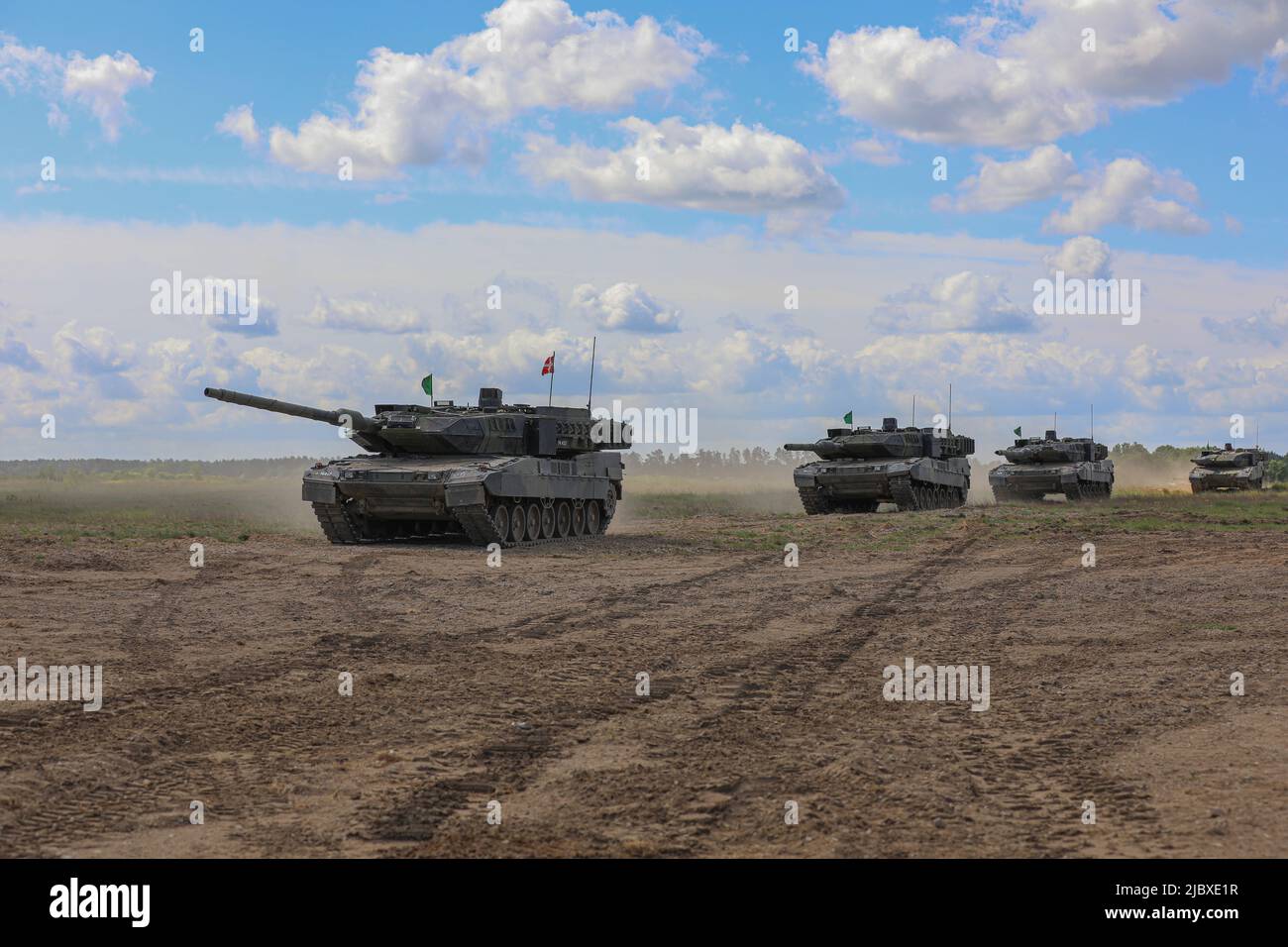 Leopard 2 tanks assigned to the Royal Danish Army advance onto the ...