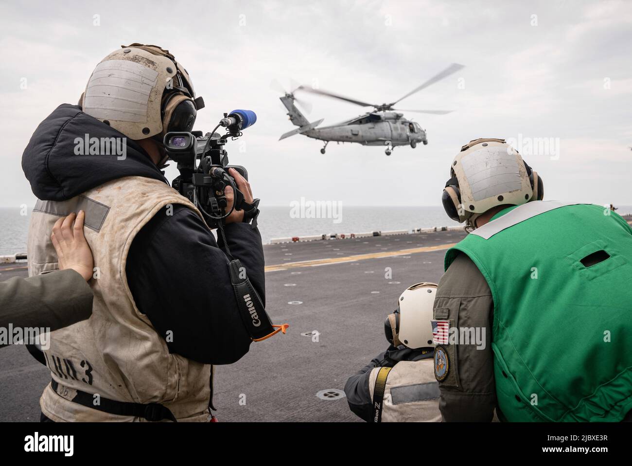 An embarked journalist with the Armed Forces Press documents flight ...