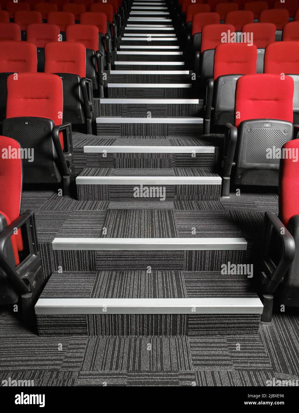 Flight of steps between rows of seats in theatre Stock Photo - Alamy