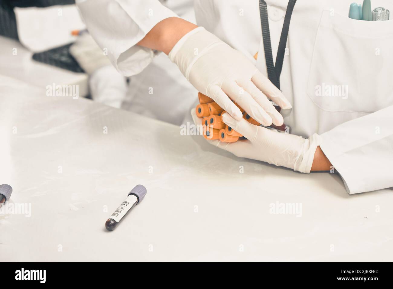 Doctor collecting group of blood samples in a laboratory Stock Photo ...