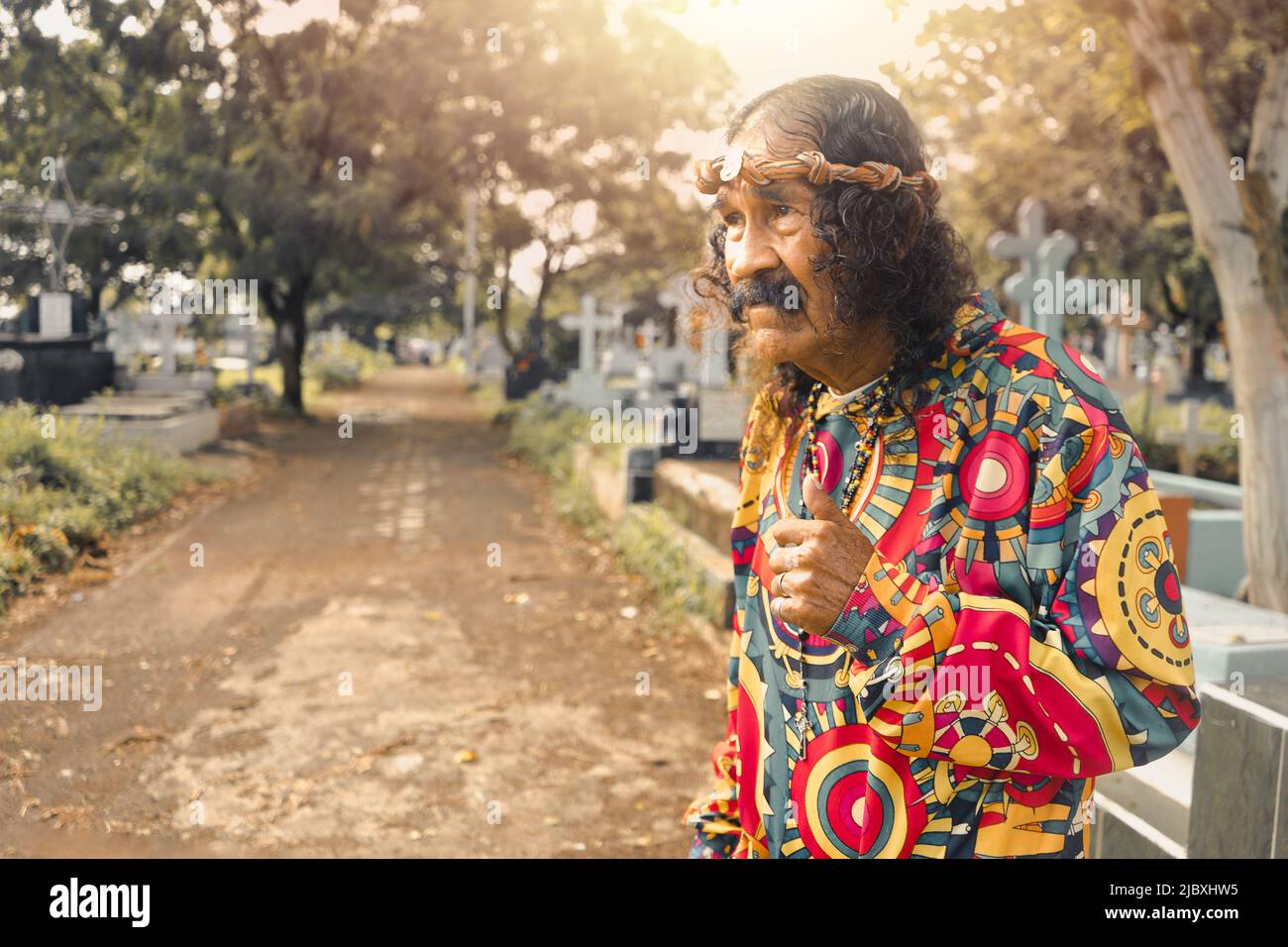 Latin man dressed as Jesus Christ with psychedelic clothes in a ...
