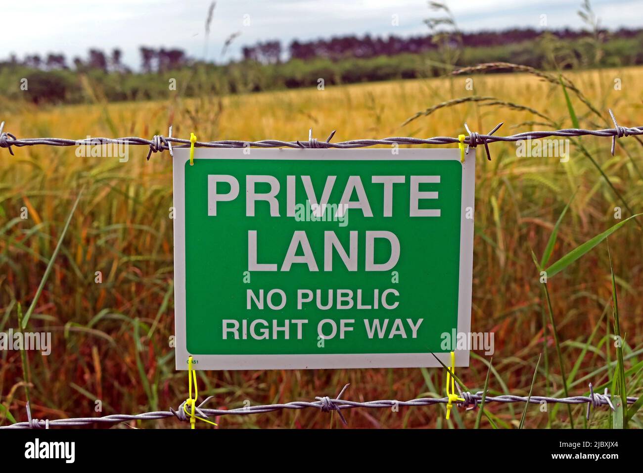 Green sign on entrance to farming land, Private Land, No Public Right ...