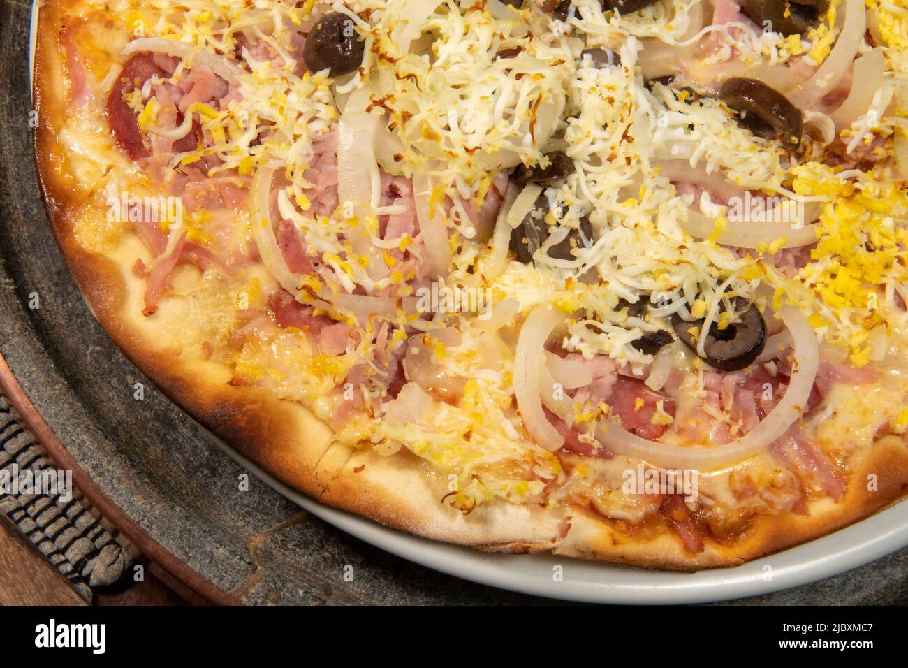 Brazilian Portuguese-style pizza with ham, egg, pepper, onion ...