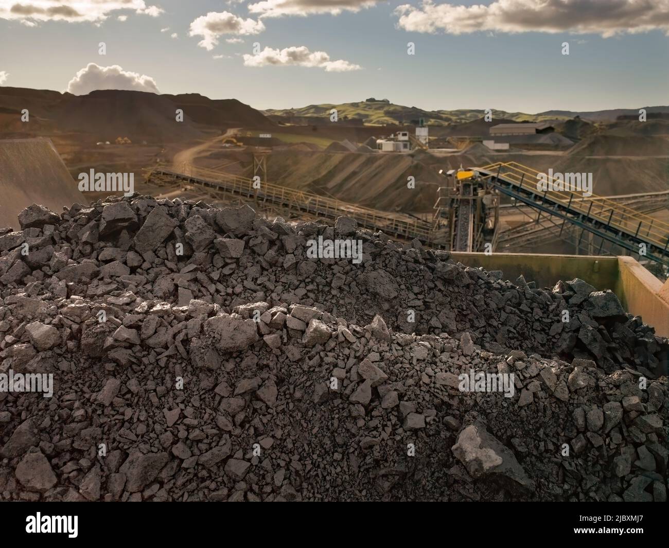 Conveyor belt moving rocks in quarry Stock Photo - Alamy