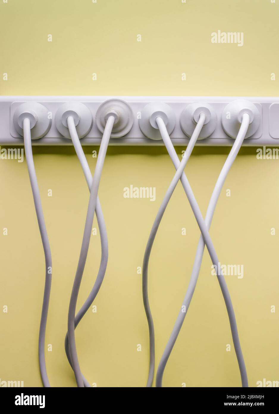 multiple plugs pulgged into panel of multiple sockets Stock Photo - Alamy
