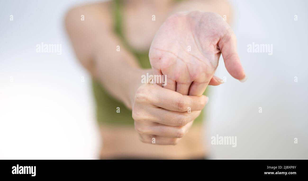 Woman stretching their arms to relax and be flexible while doing ...