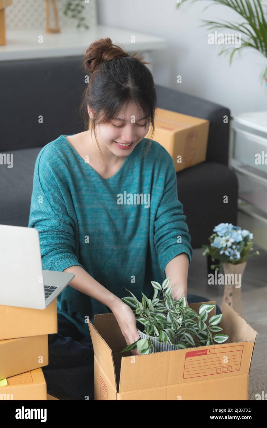 Asian small business owner working at home office. Business retail ...