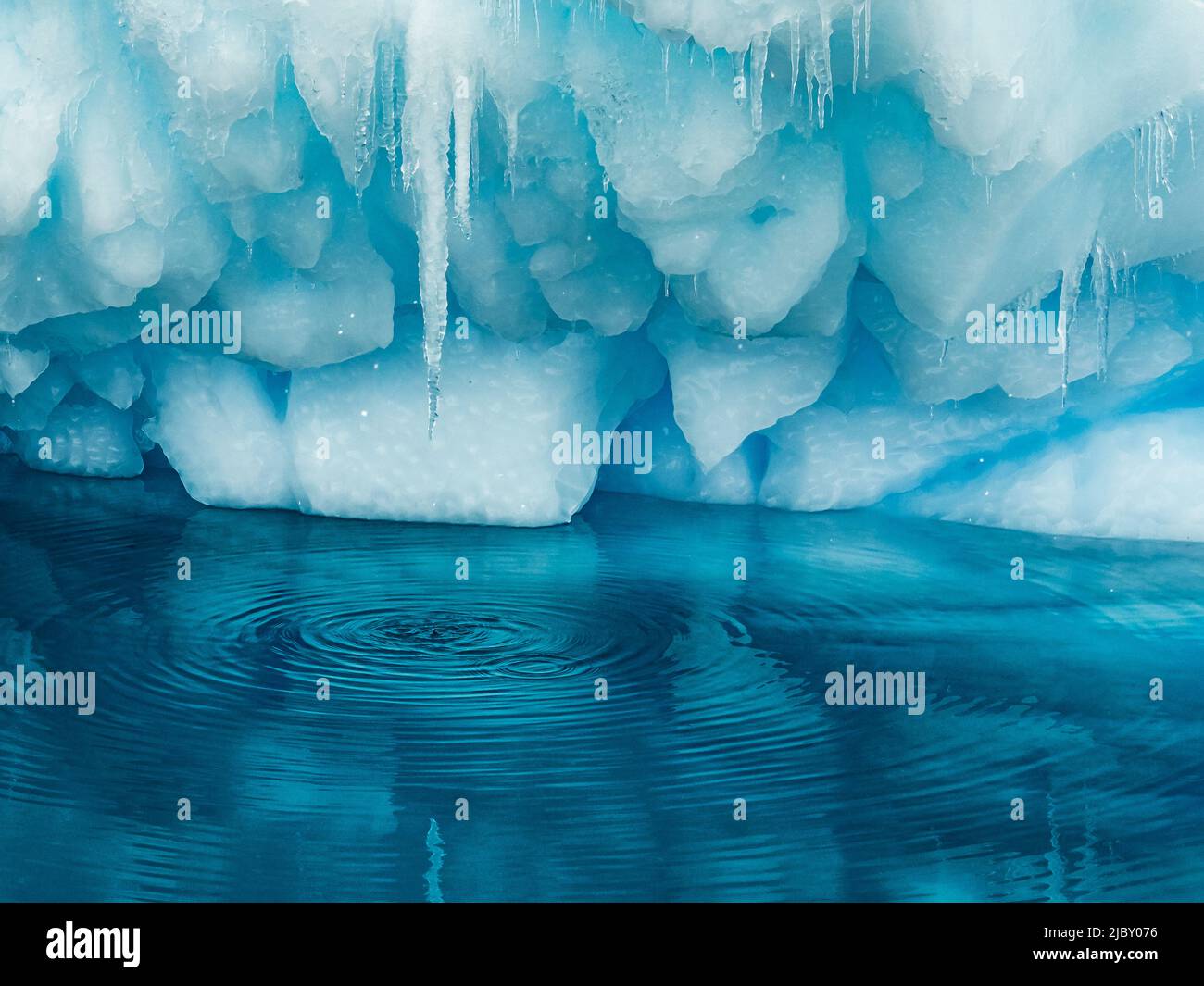 Melting Ice, Ice icicles and blue water pool, Antarctica Stock Photo ...