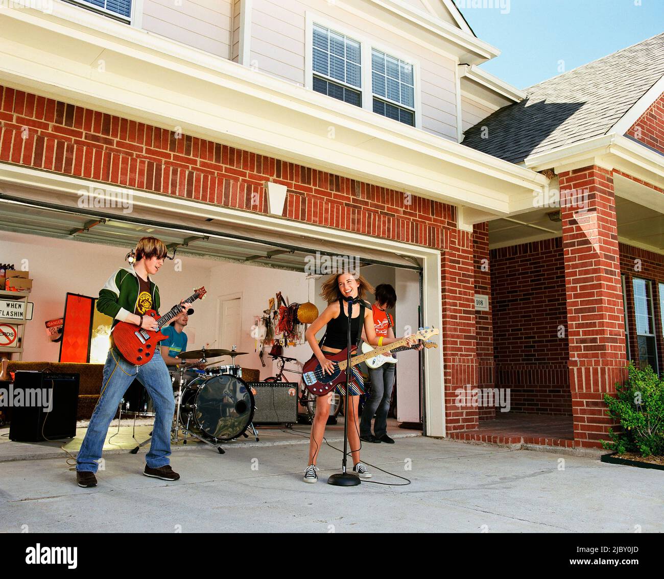 Teenage playing instrument band home hi-res stock photography and ...