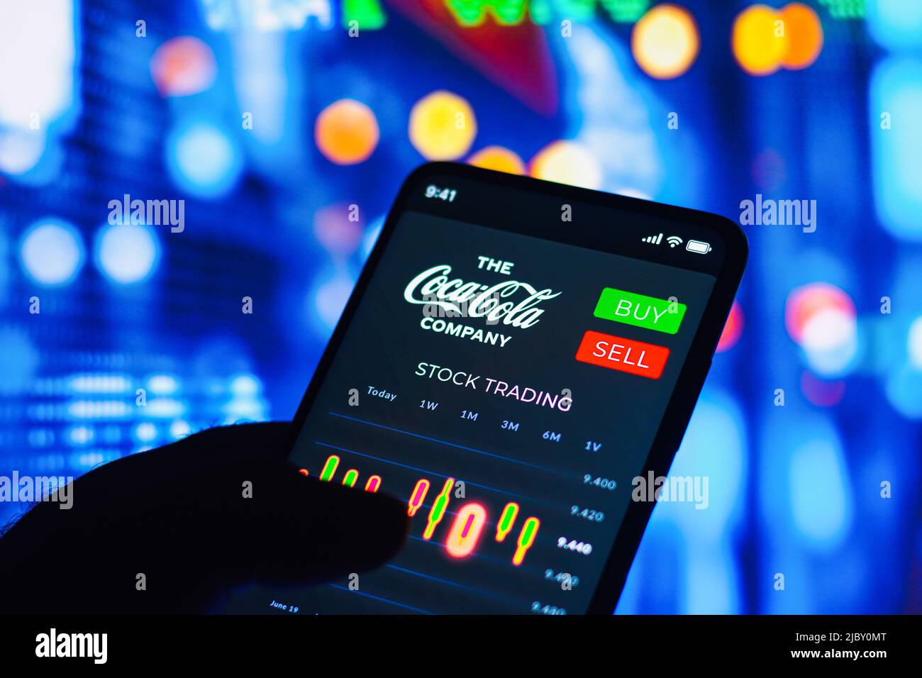 In this photo illustration, the stock trading graph of Coca-Cola ...