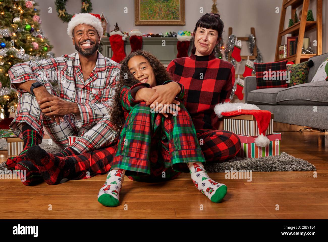 Multi cultural family celebrating Christmas Stock Photo - Alamy