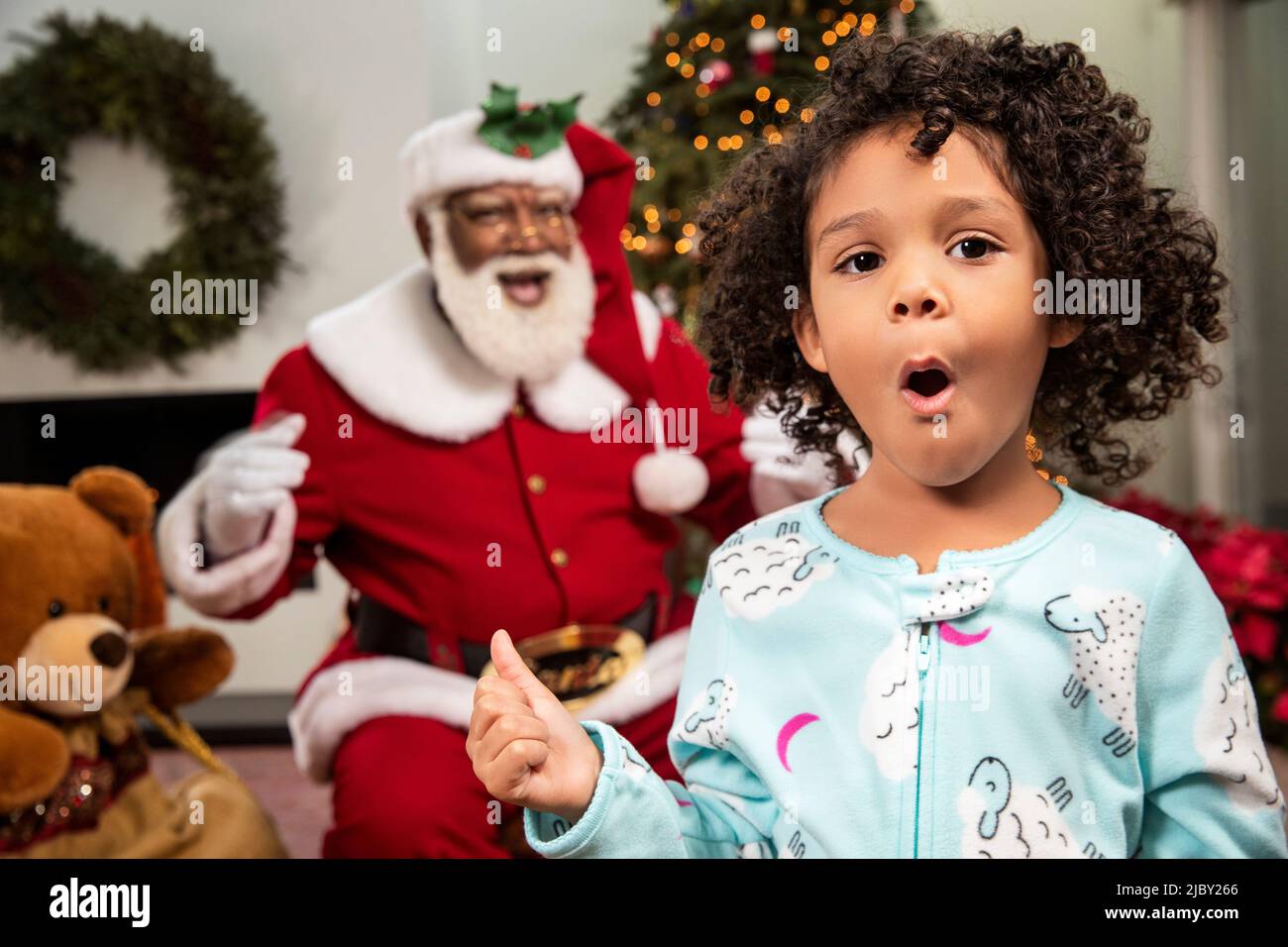 Portrait of a young African American standing in living room in shock ...