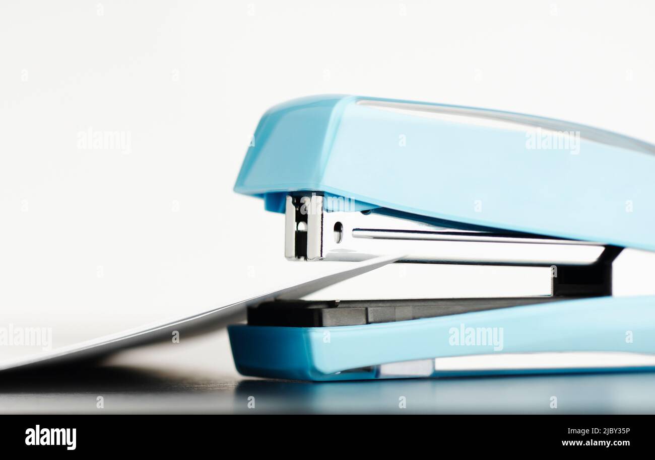 Stapler and paper Stock Photo - Alamy